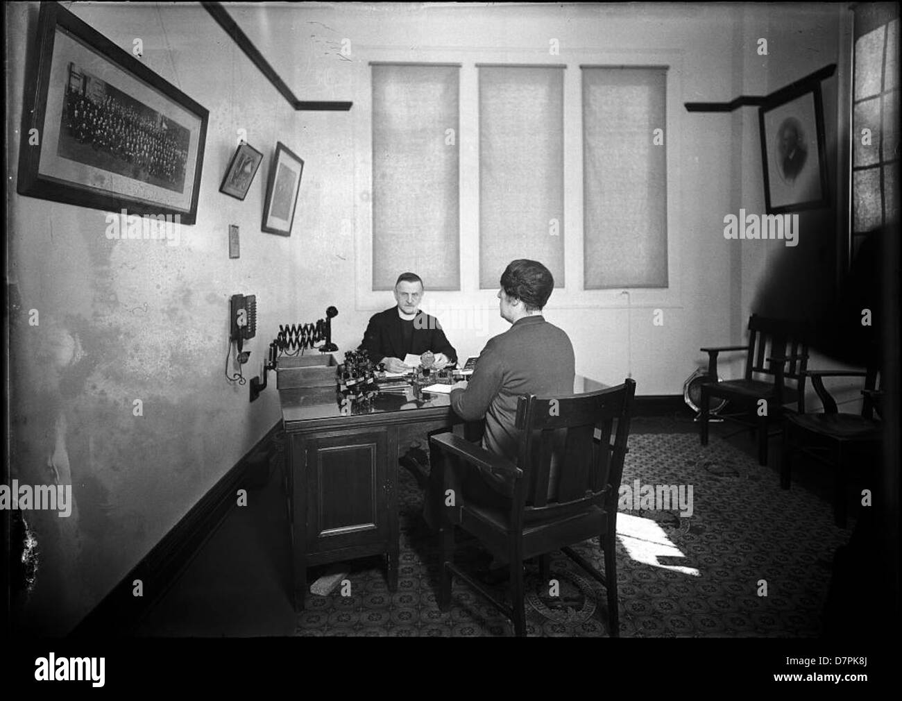 This image depicts office workers in a historical setting at the ...