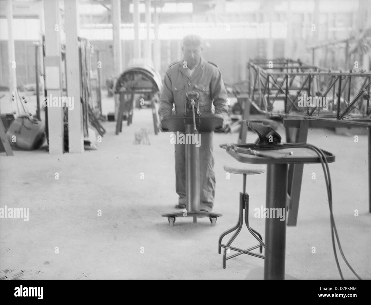 A photograph showing a man using a portable vice and workbench ...
