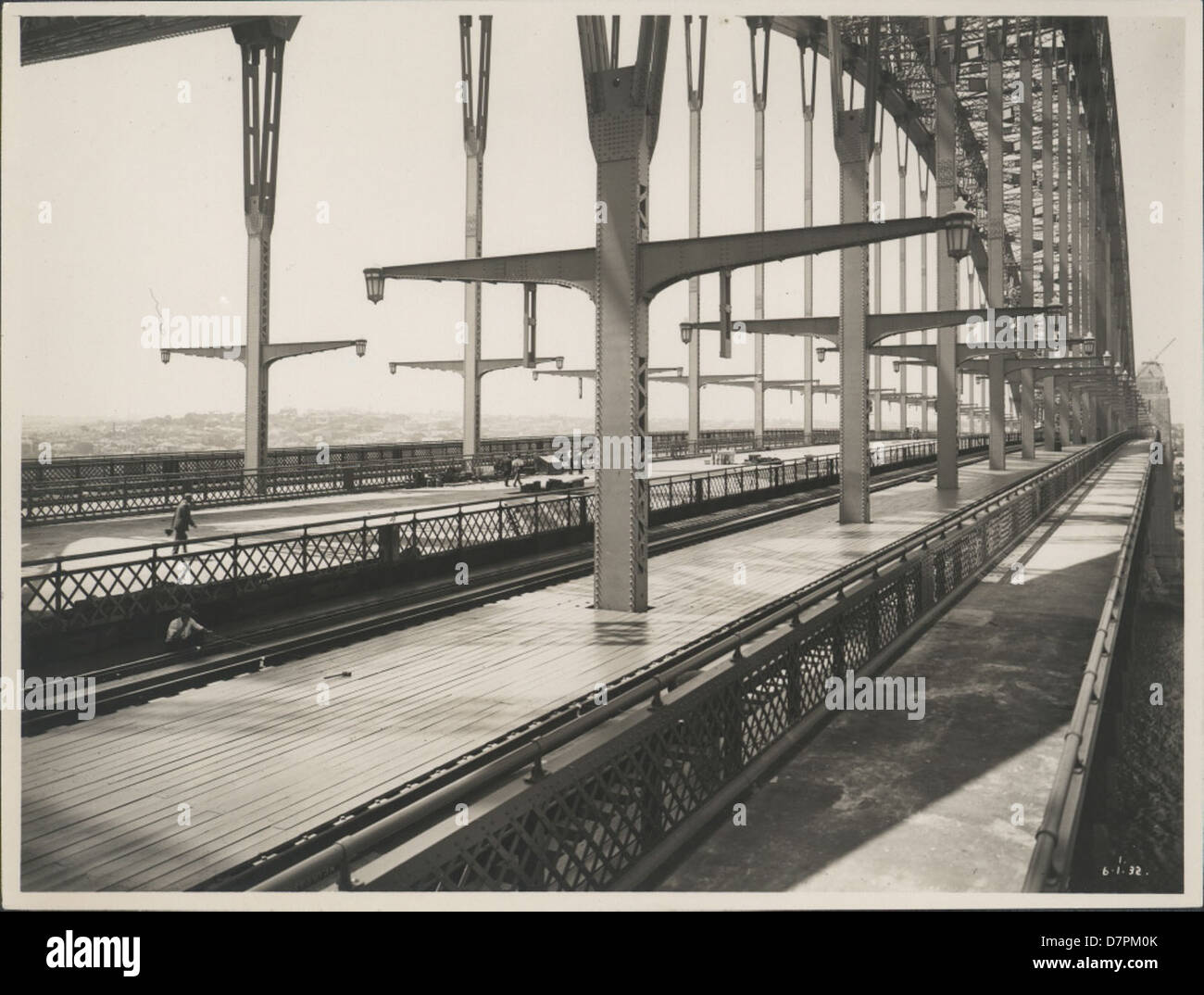 This photograph captures the construction of the iconic Sydney Harbour ...