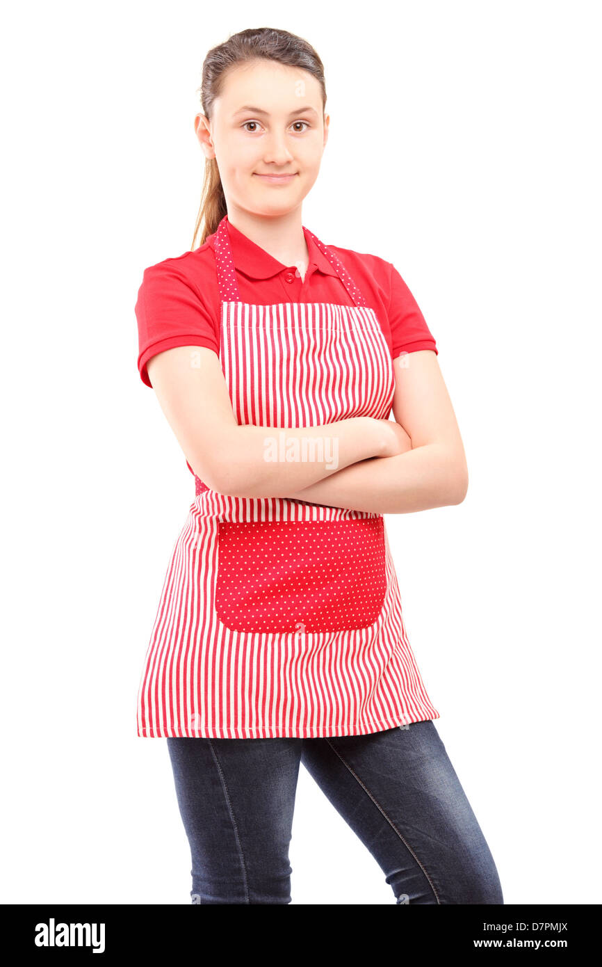 Smiling girl wearing an apron and looking at camera isolated on white ...