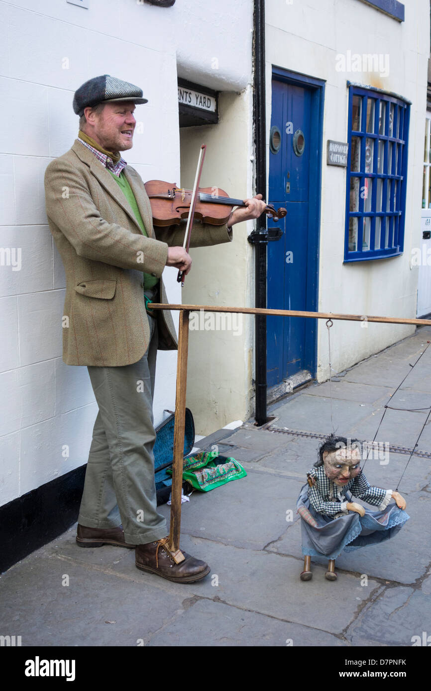 Busker with puppet in Whitby, North Yorkshire, England, UK Stock Photo ...
