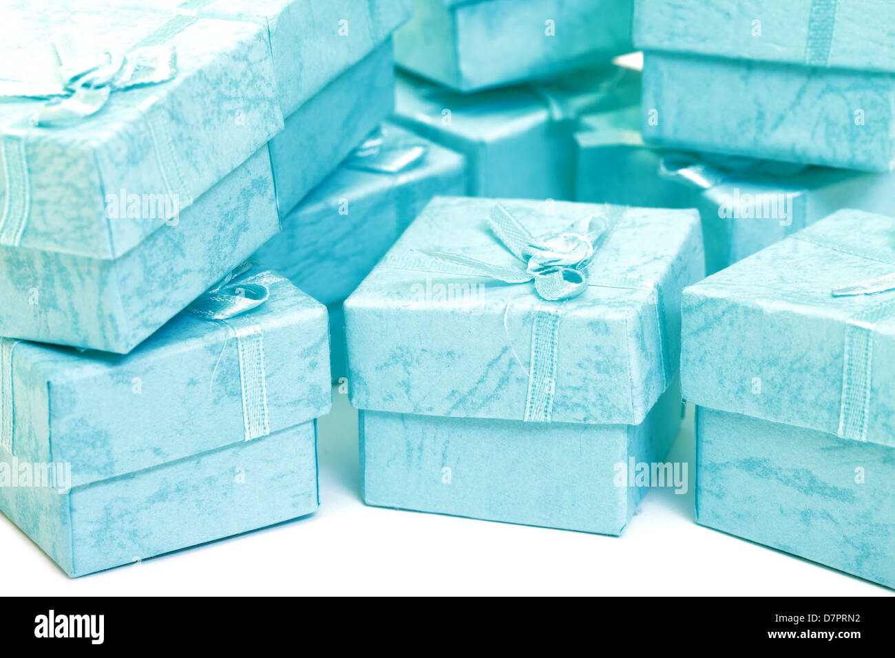 Cyan gift boxes closeup on white background Stock Photo - Alamy