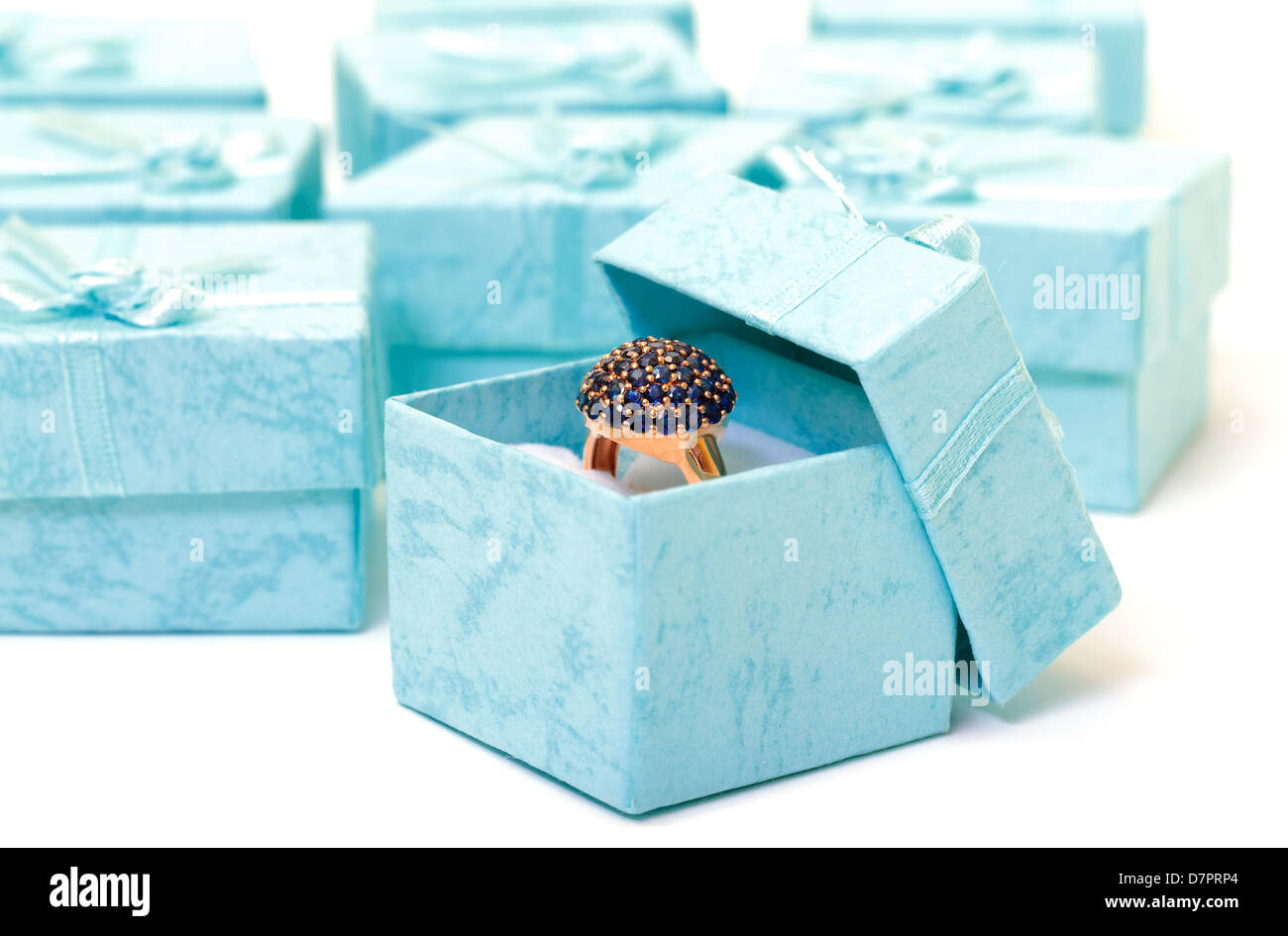 Cyan gift boxes with ring closeup on white background Stock Photo - Alamy