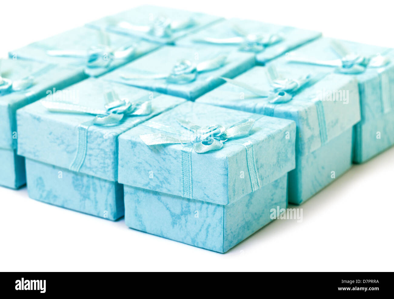 Cyan gift boxes closeup on white background Stock Photo - Alamy