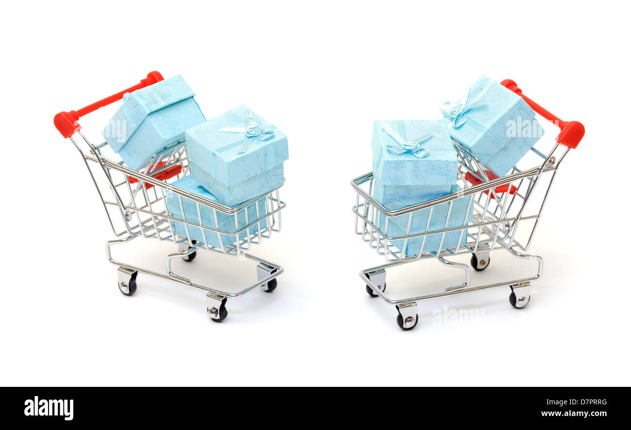 Cyan gift boxes in shopping carts on white background Stock Photo - Alamy