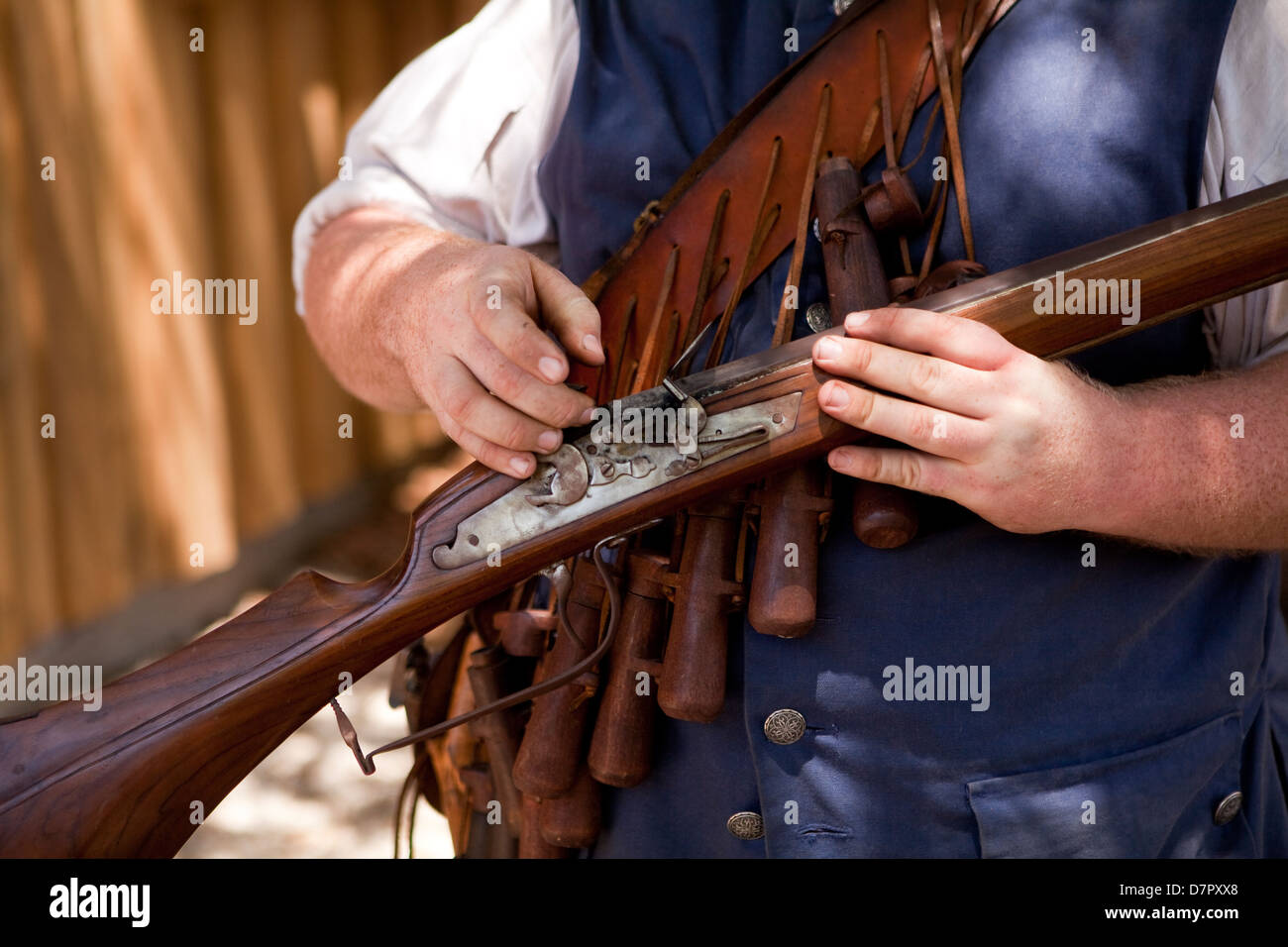 A reenactor demonstrate how to fire a musket in the Colonial Quarter ...