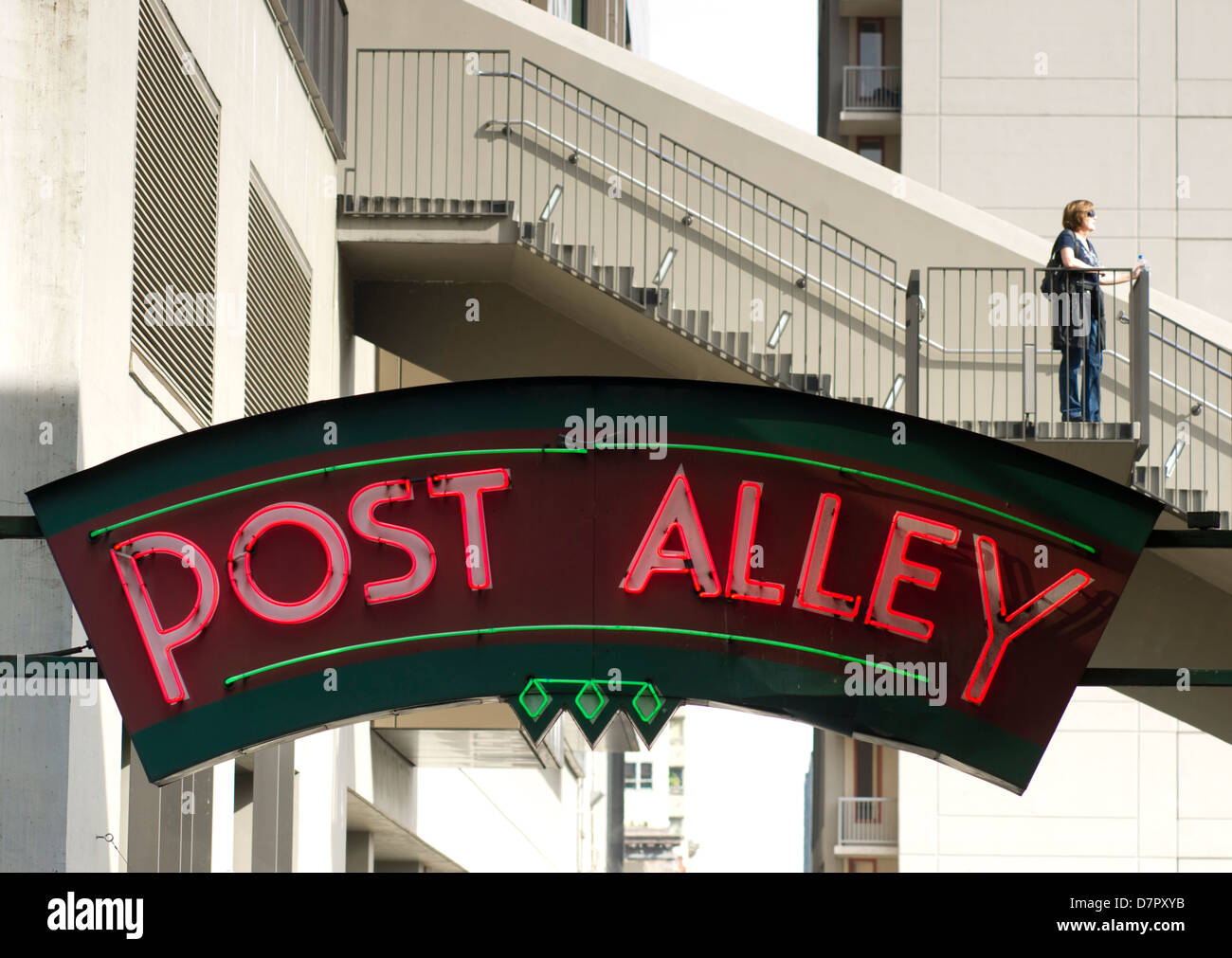 A Stairway comes up from the waterfront over Post Alley Sign in Seattle ...