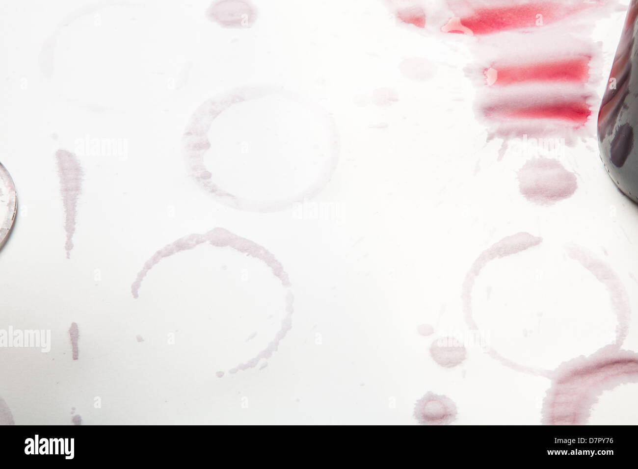 Red wine stains on a white background. Glass rings and wine splatters ...