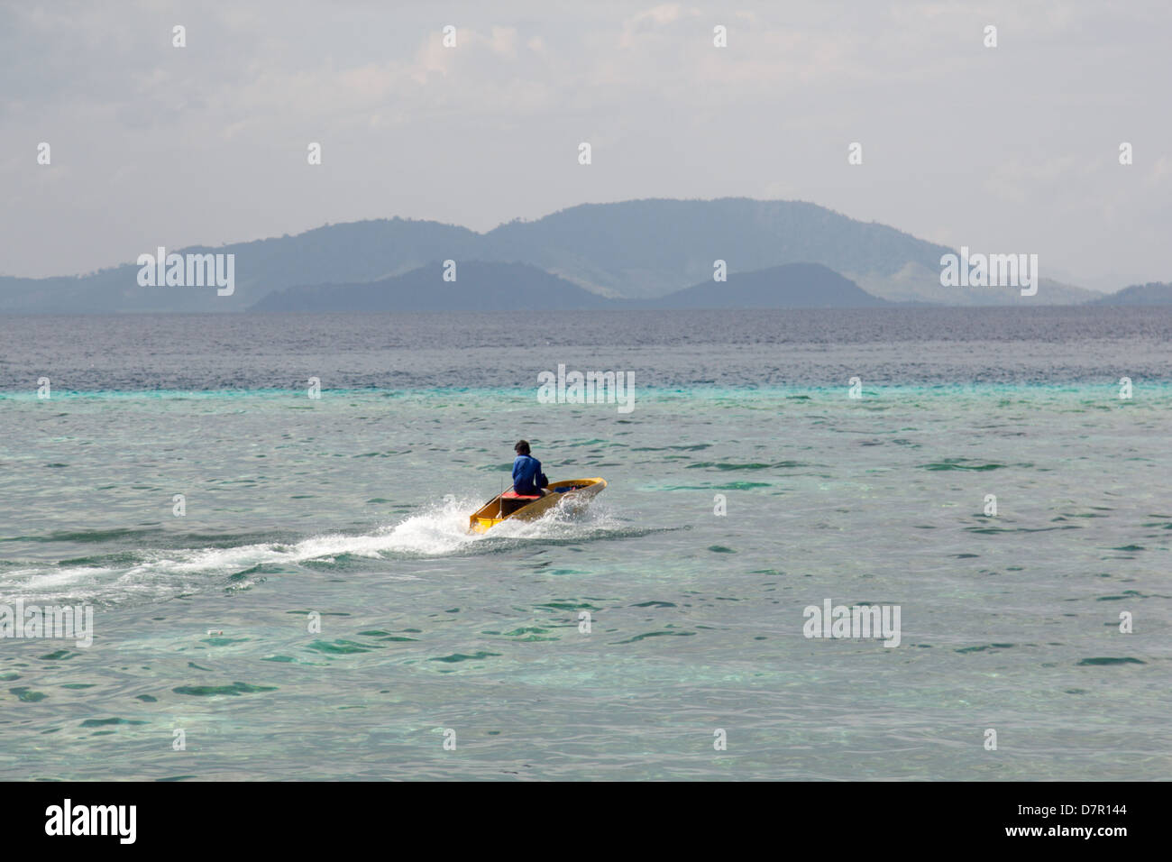 a man on a motorboat Stock Photo - Alamy