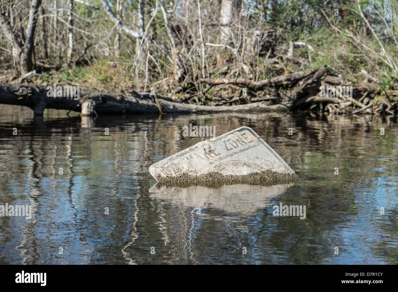 A "No Wake" sign submerged in swamp water Stock Photo - Alamy