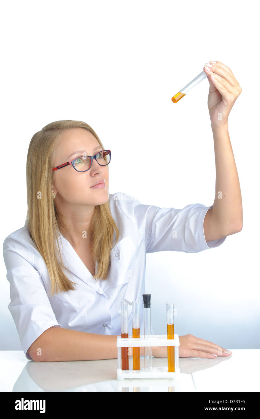 Young beautiful female scientist with flasks Stock Photo - Alamy