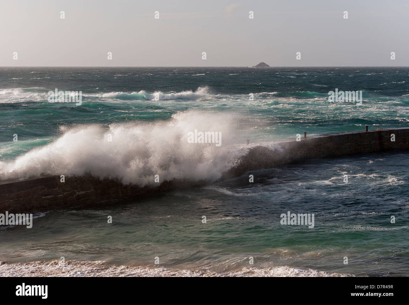 Waves crashing over the breakwater at Sennen Cove Stock Photo - Alamy