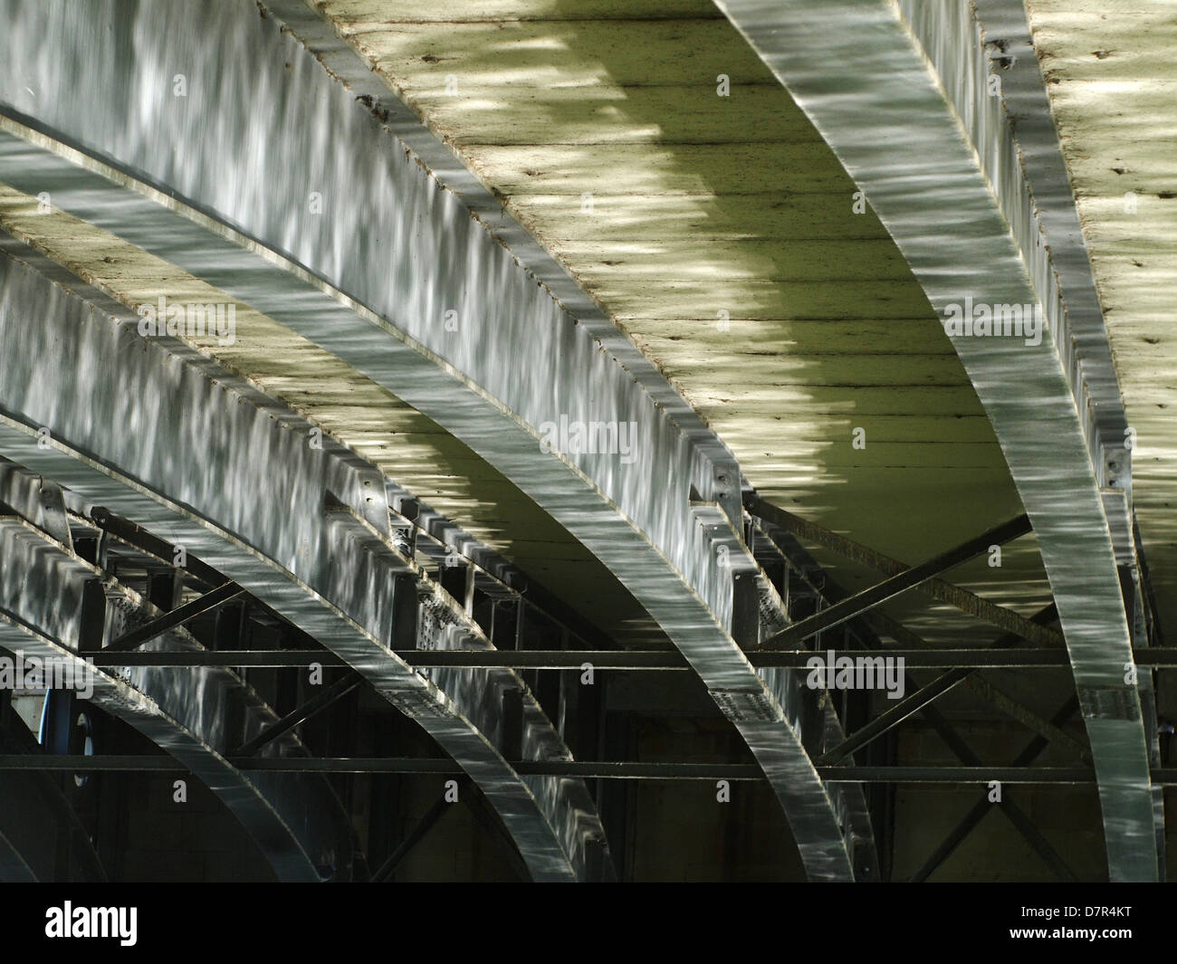 Dappled sunlight reflected under a bridge Stock Photo - Alamy