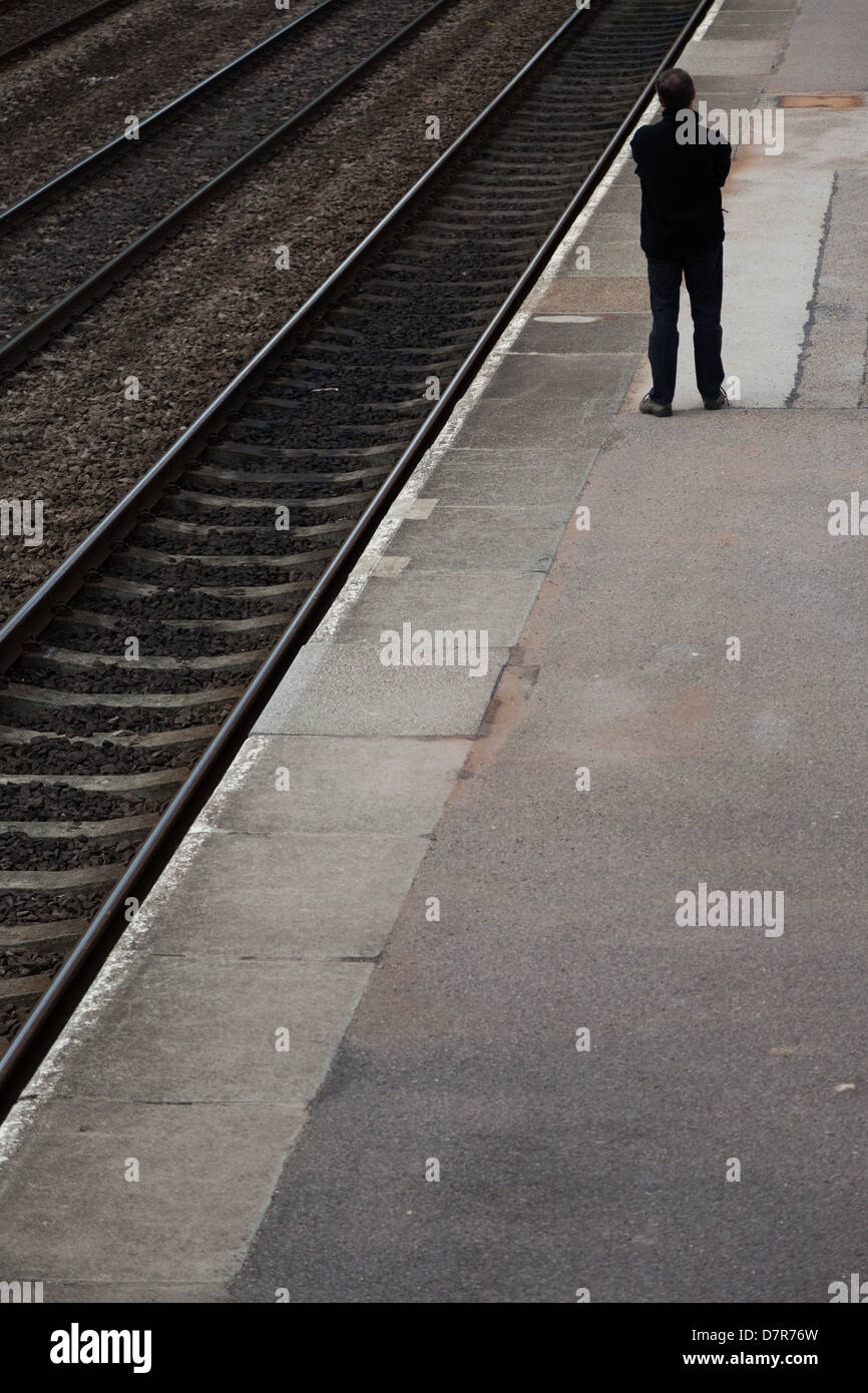 Man standing train station hi-res stock photography and images - Alamy
