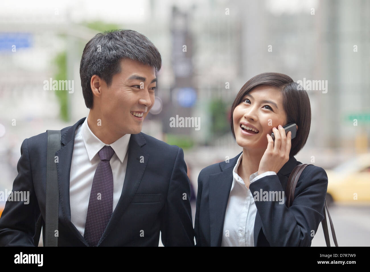 Two Business People Walking Together Stock Photo - Alamy