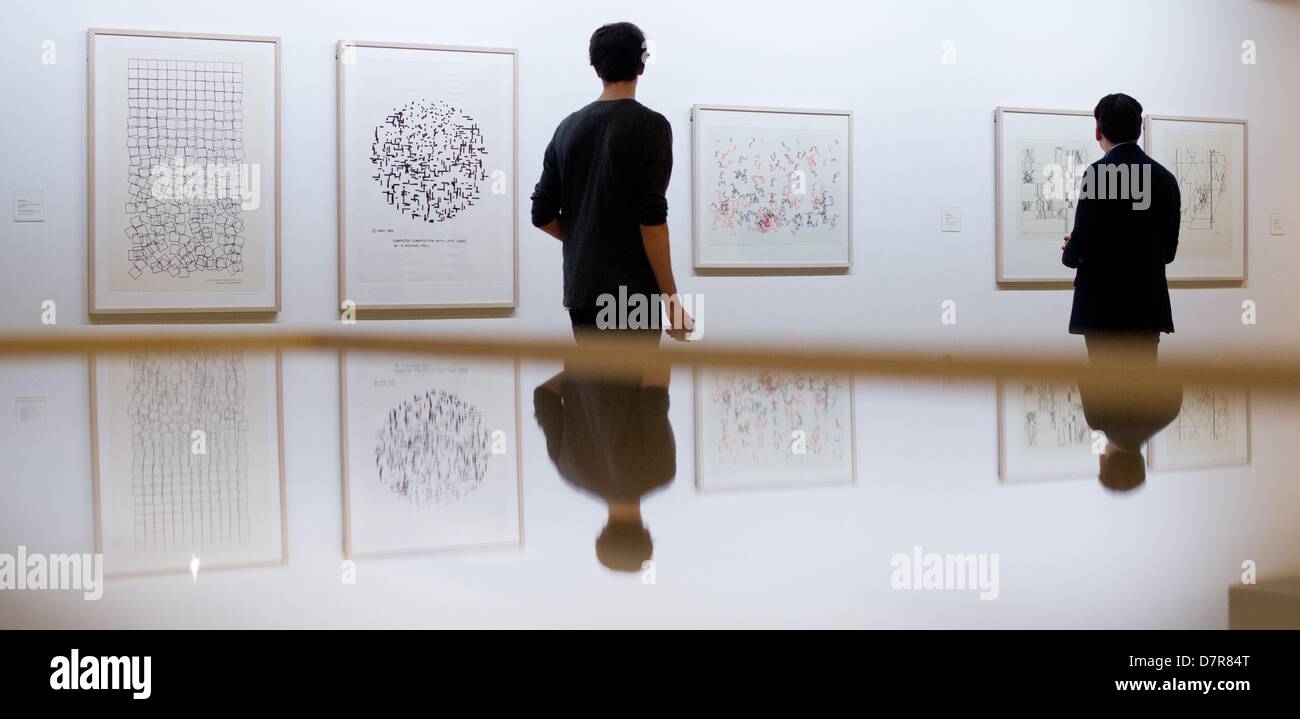 Two visitors walk past works by Georg Nees (L-R), A. Michael Noll ...
