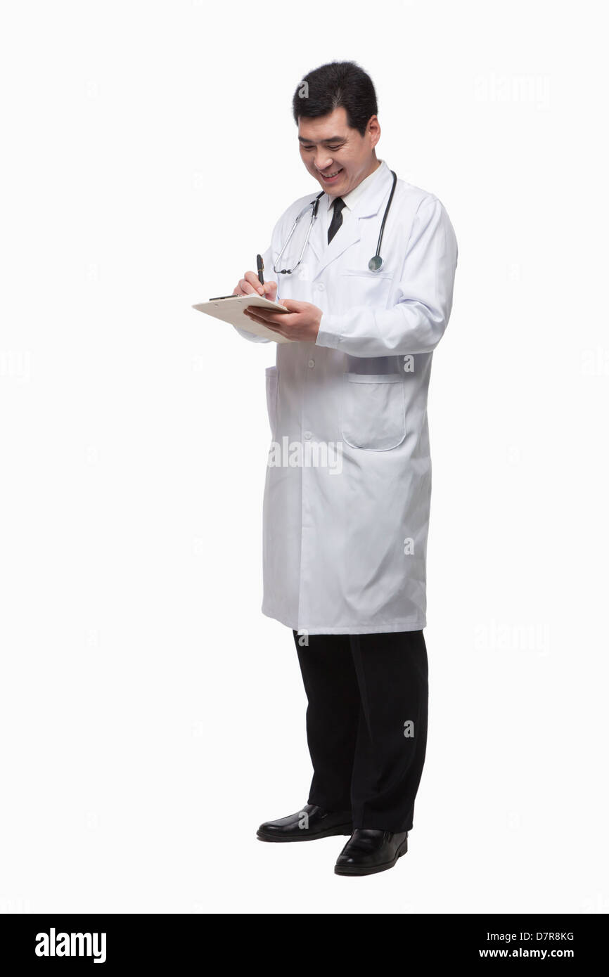 Full Length Portrait of Doctor Writing Medical Record Stock Photo - Alamy