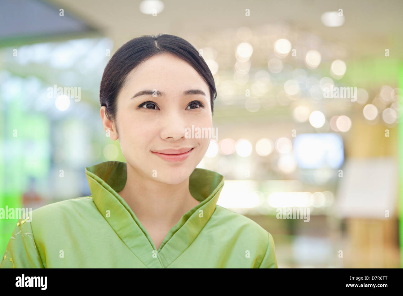 Restaurant/Hotel Hostess in Traditional Chinese Clothing, Looking Away ...