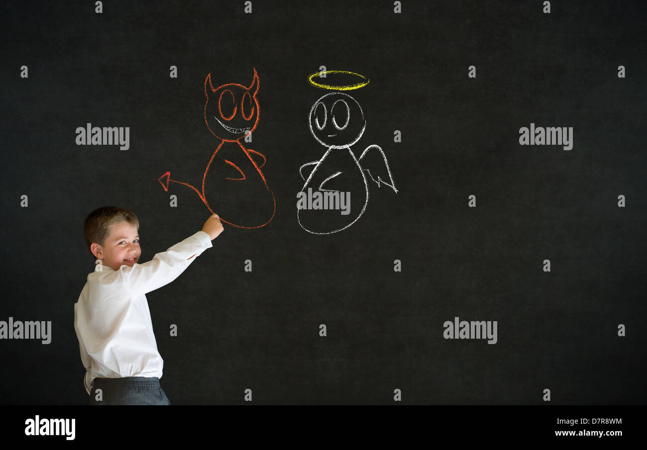 Writing boy dressed up as business man with chalk angel and devil on ...
