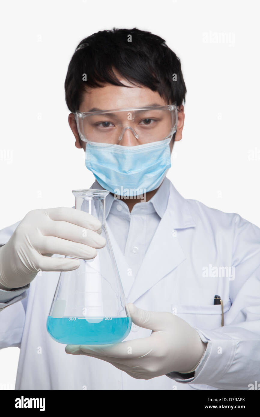 Scientist Holding Beaker Stock Photo - Alamy