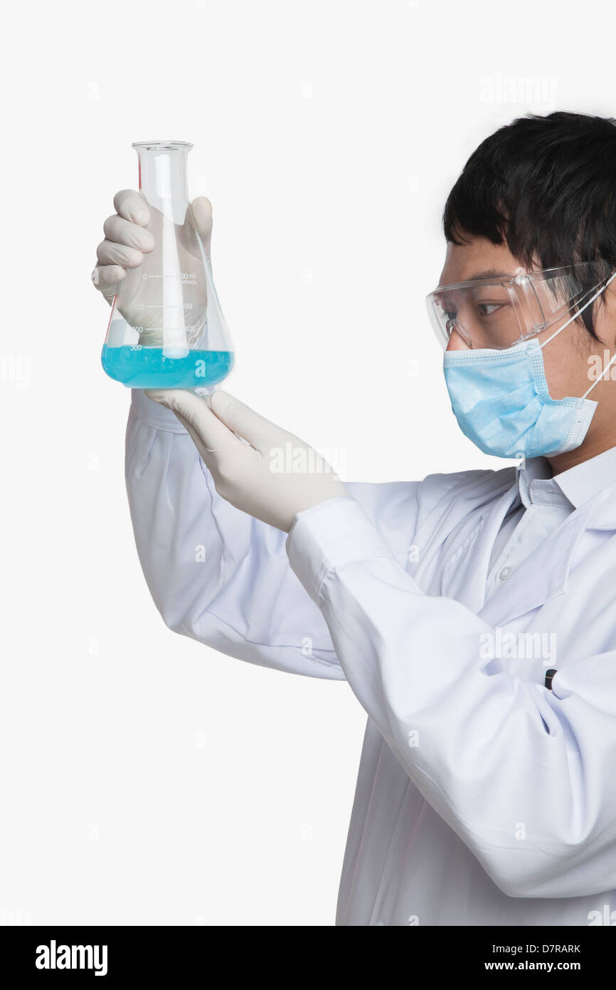 Scientist Looking at Beaker Stock Photo - Alamy
