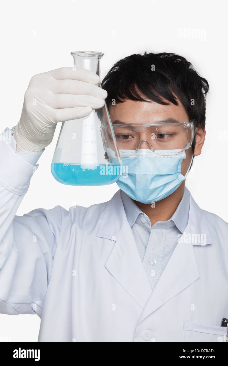 Scientist Looking at Beaker Stock Photo - Alamy