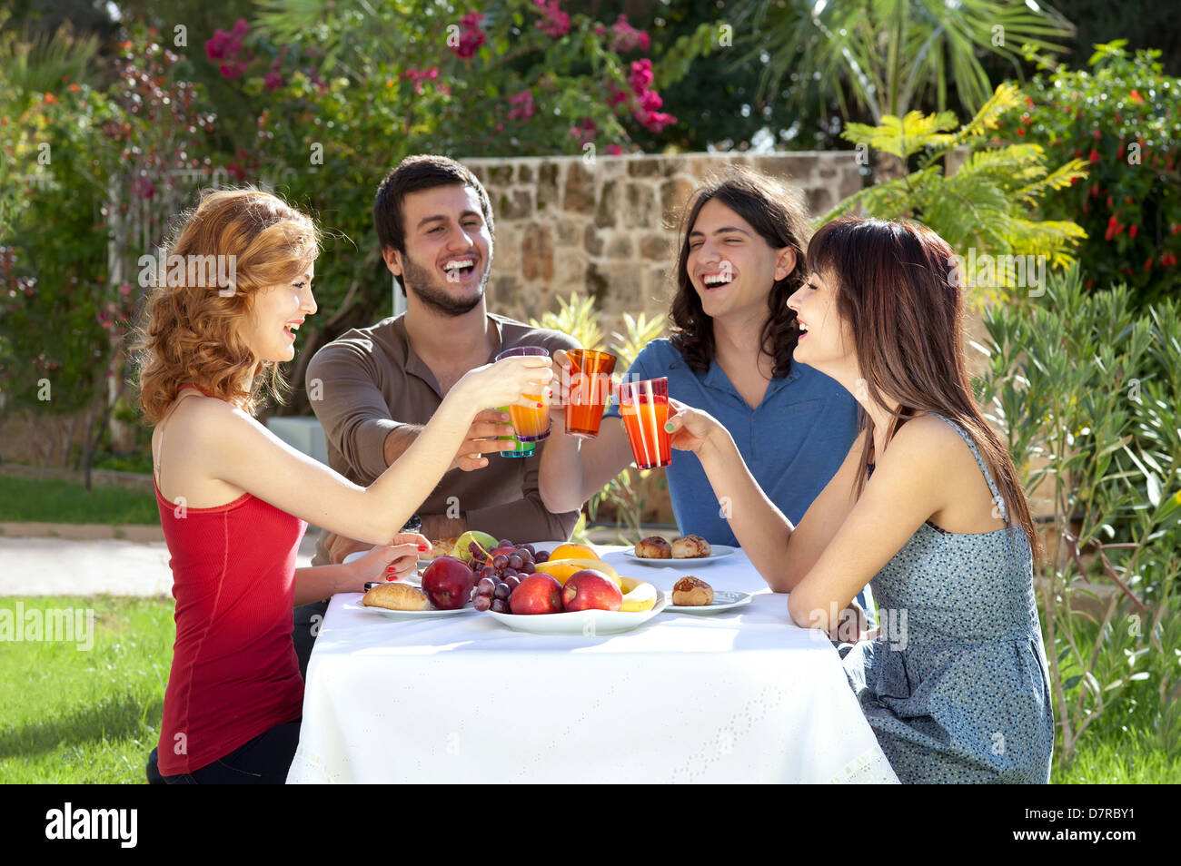 Two couples celebrating Stock Photo - Alamy