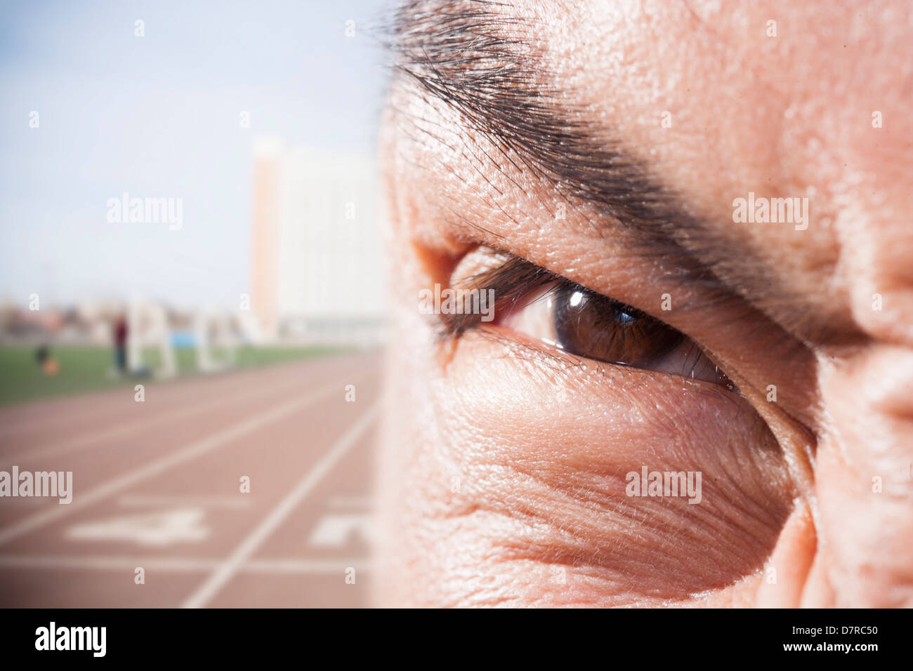 Athlete's eye with angry expression, close-up Stock Photo - Alamy