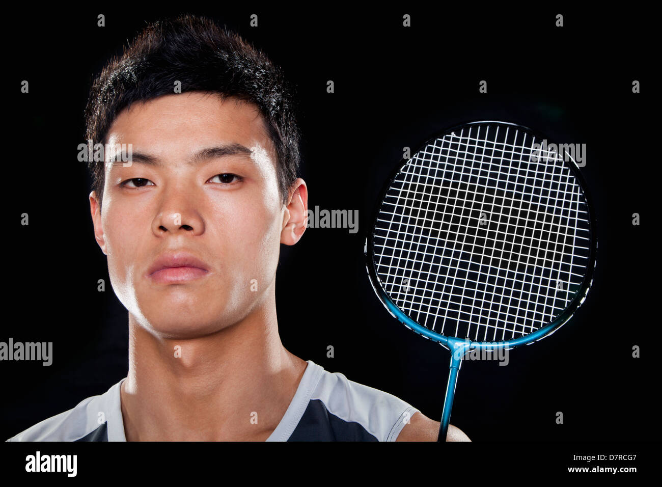 Man with badminton racket, portrait Stock Photo - Alamy