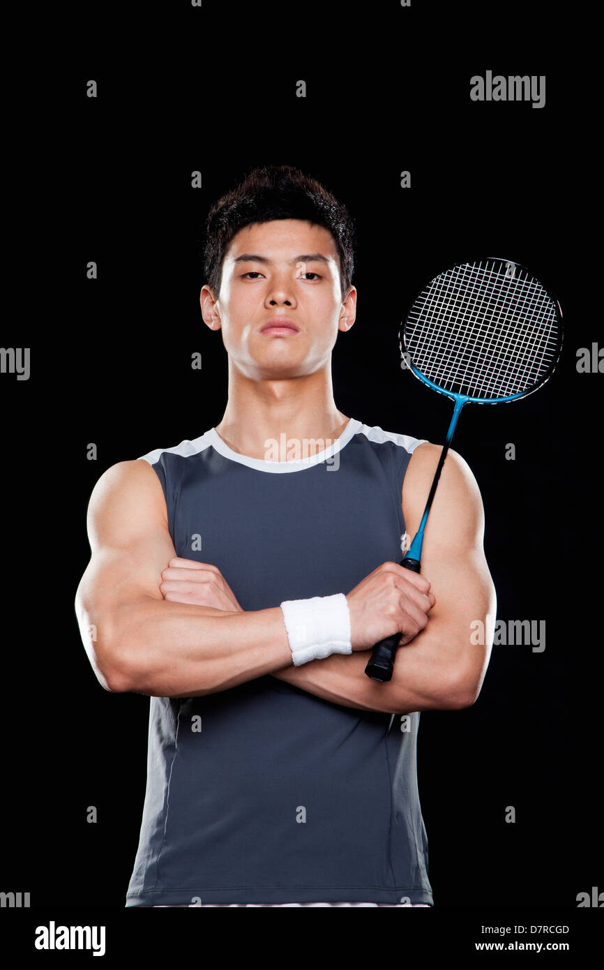 Man with badminton racket, portrait Stock Photo - Alamy