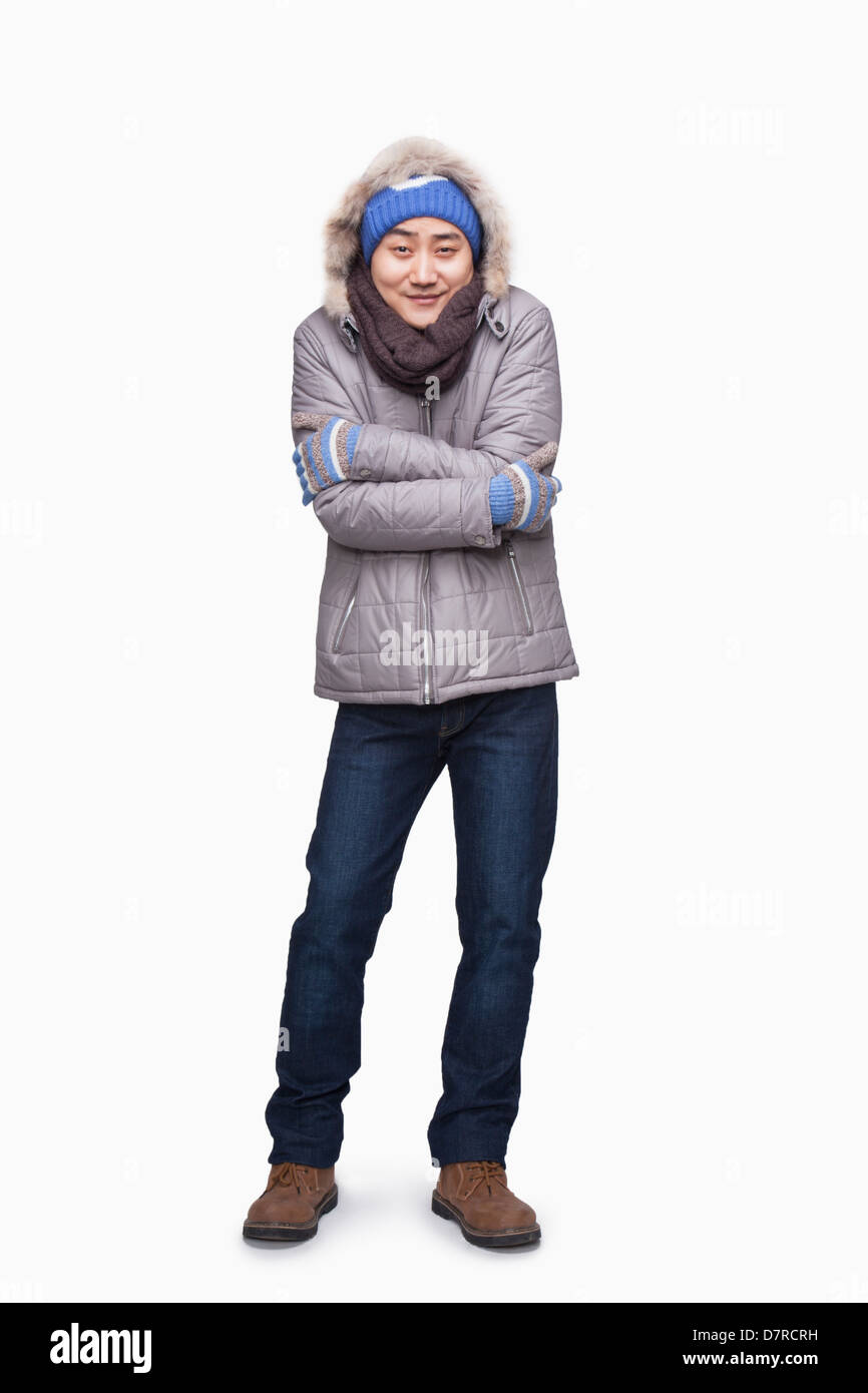 Man in winter clothes freezing Stock Photo - Alamy