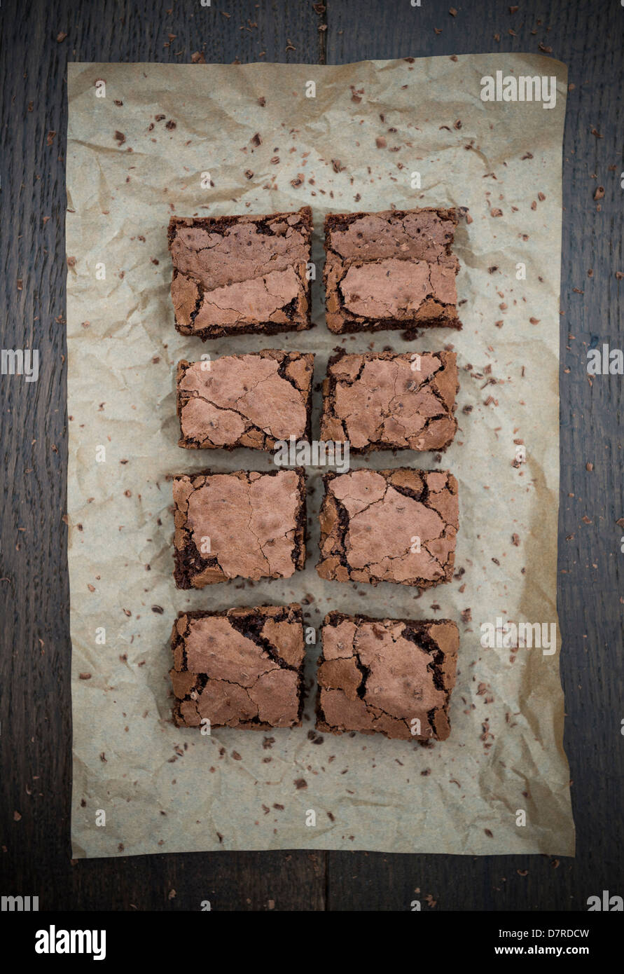 Chocolate brownies on greaseproof paper Stock Photo - Alamy