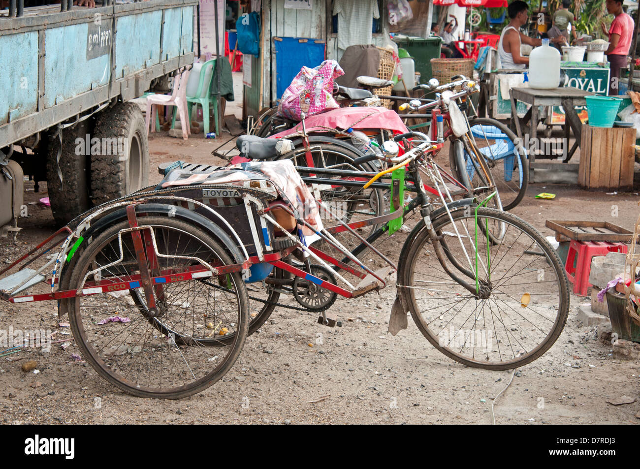 A group of bicycle rickshaws consist of two seats in a side car design ...