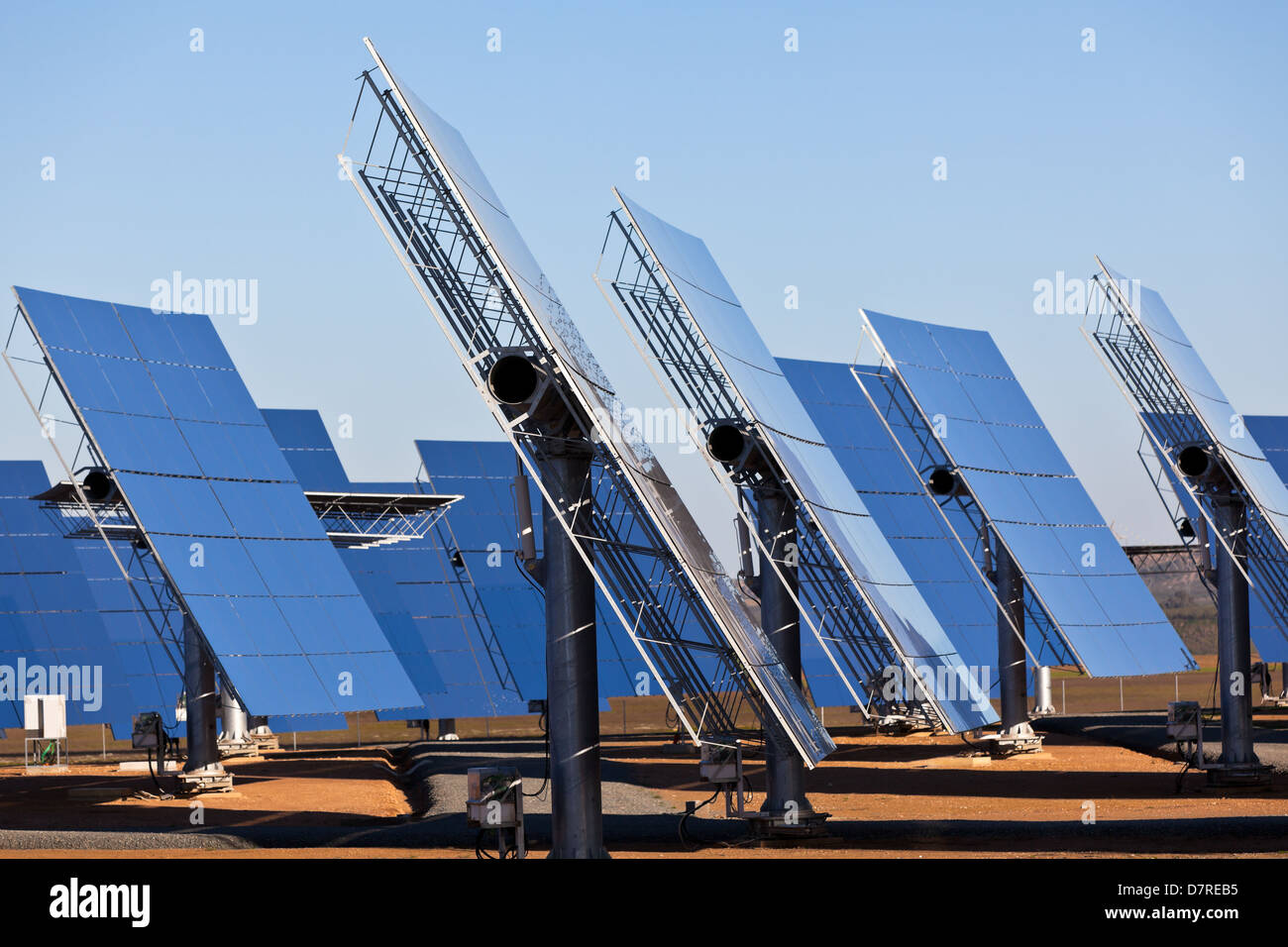 Solar panels on bright blue sky background. Renewable Energy ...