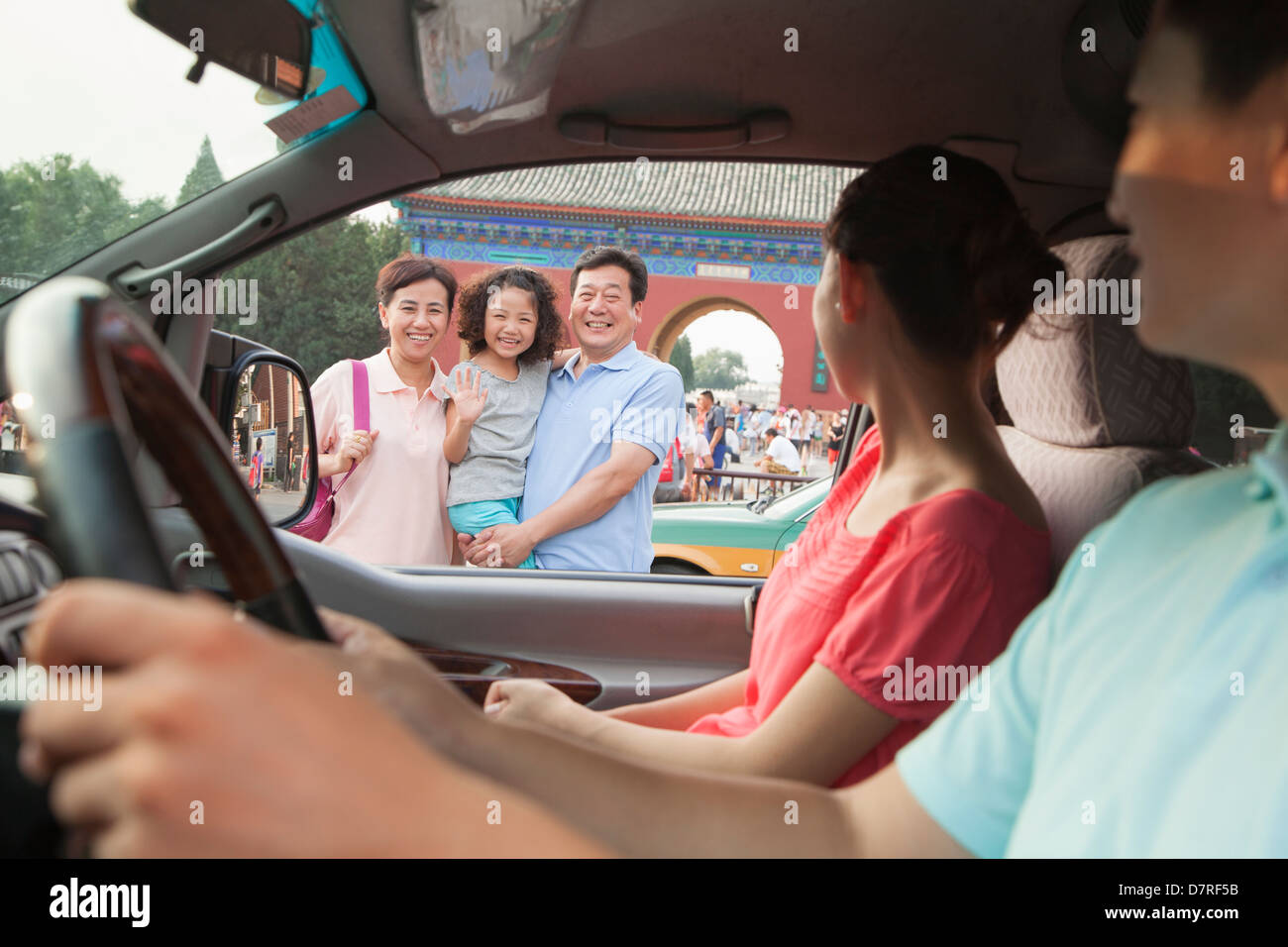 Parents driving and saying good bay to son and grandparents Stock Photo ...