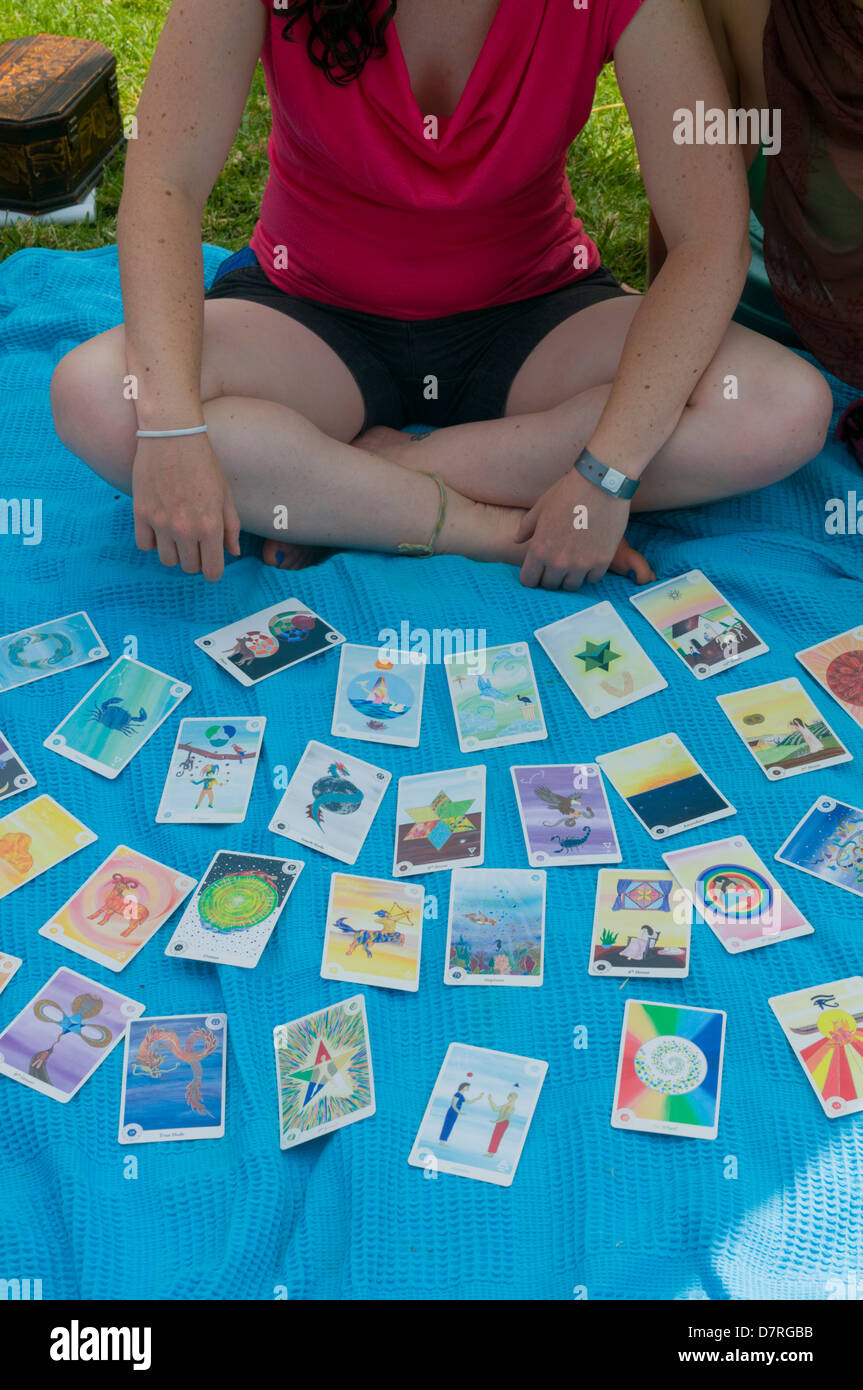 Young fortune teller with astrological cards on a blanket Stock Photo ...
