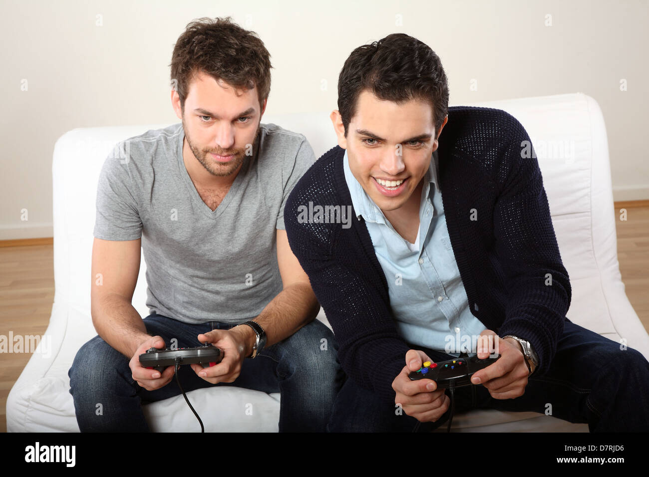 two man play with computer Stock Photo - Alamy