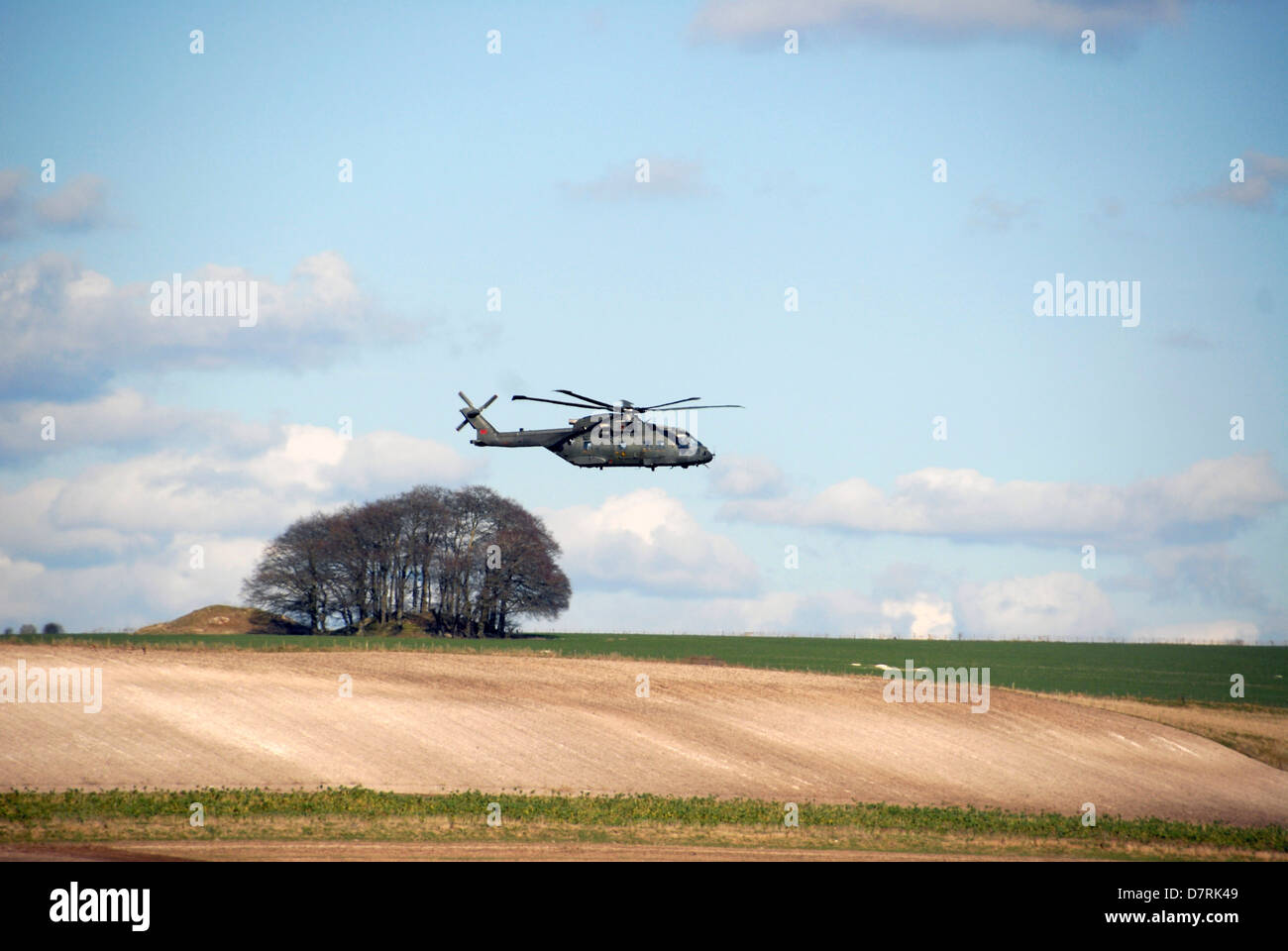 RAF helicopter flying low over farm land in Wiltshire countryside ...