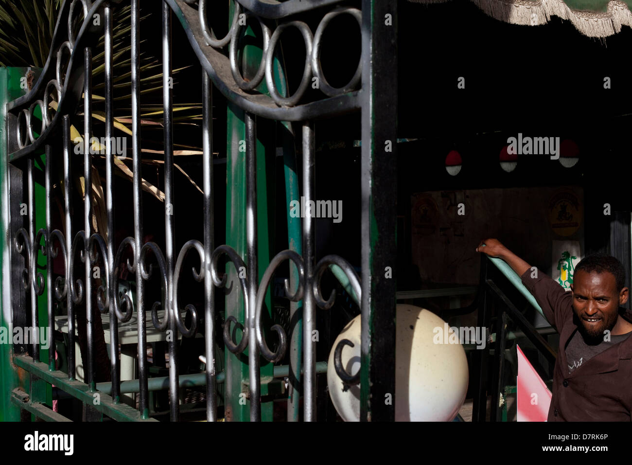 A man waits outside a cafe in the Piazza district in Addis Ababa ...