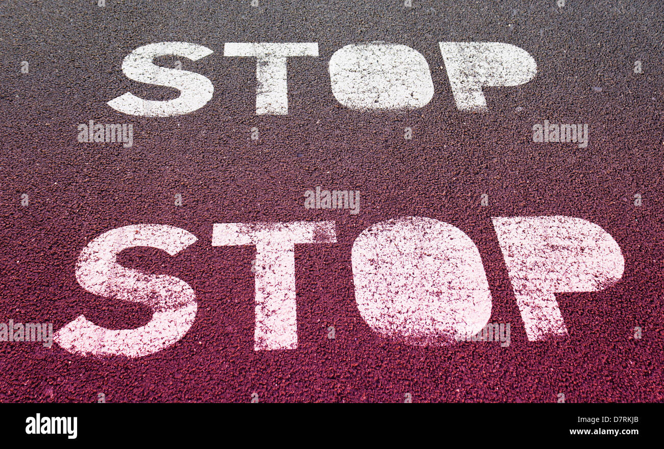 Words stop painted on road Stock Photo - Alamy