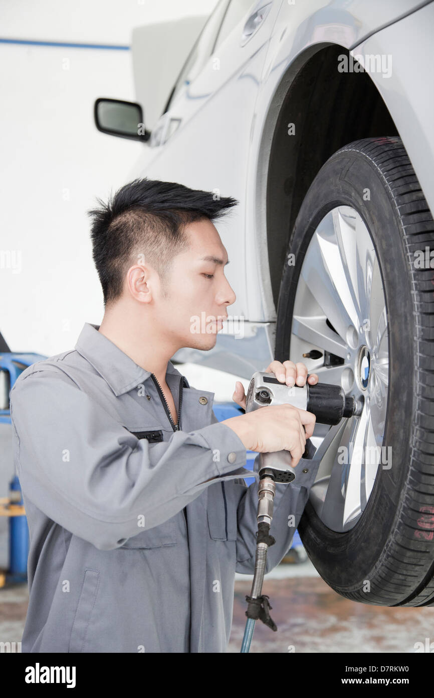 Mechanic Using Power Tool Stock Photo - Alamy