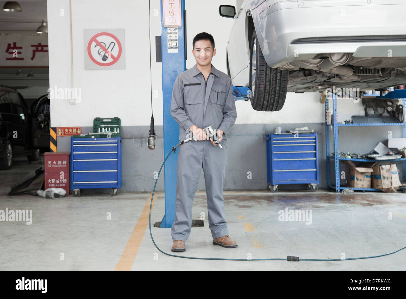 Mechanic Using Power Tool Stock Photo - Alamy