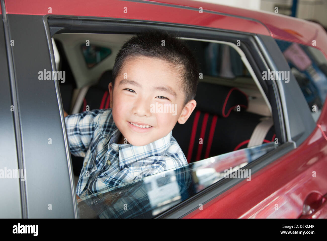 Young Boy Looking Out a Car Window Stock Photo - Alamy