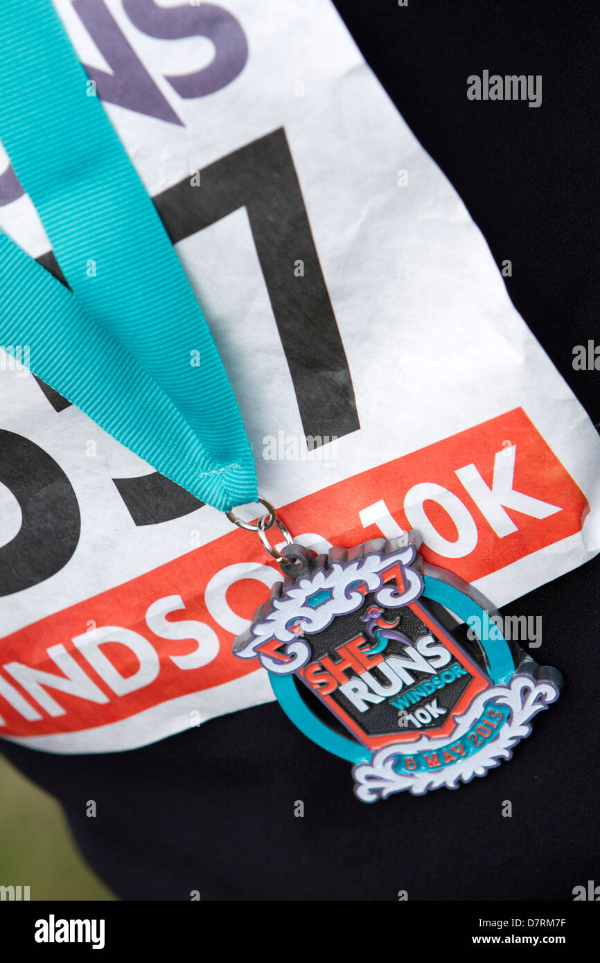 She Runs Windsor 10km race finisher's medal Stock Photo - Alamy