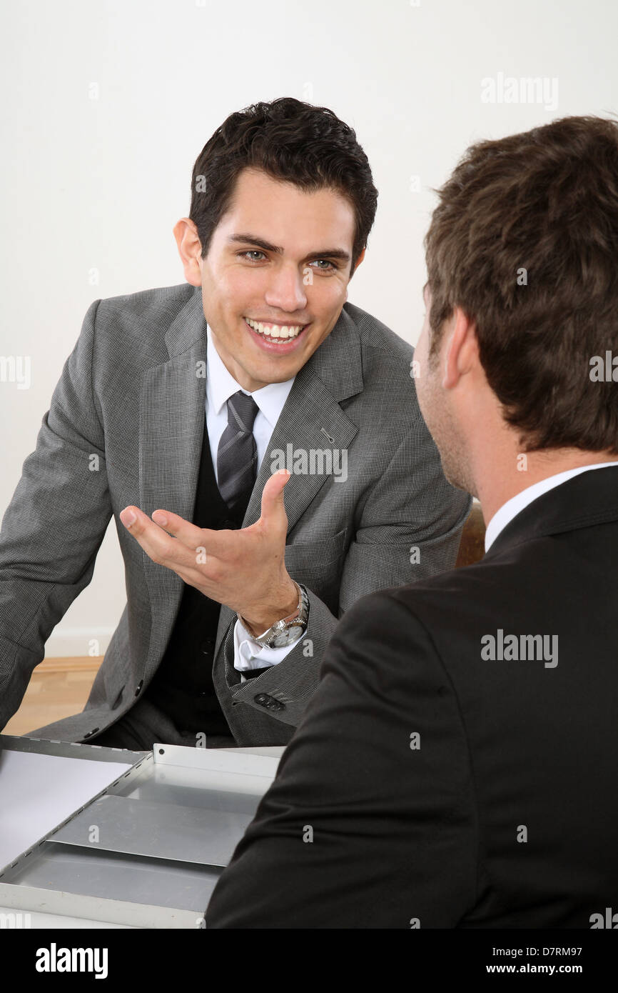 two man explaining Stock Photo - Alamy