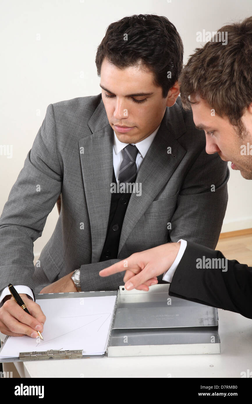 two man explaining Stock Photo - Alamy