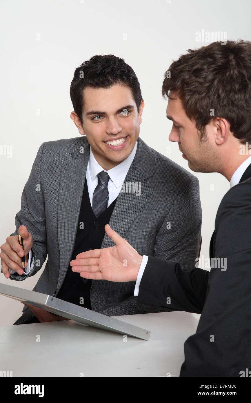 two man explaining Stock Photo - Alamy