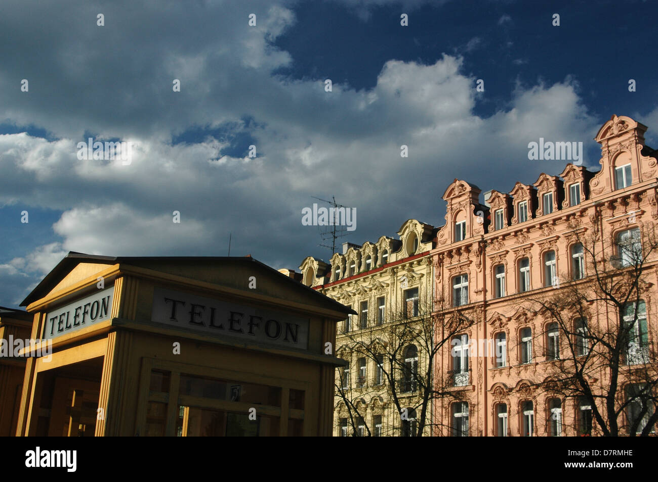 Old style telephone kiosk and classic houses in Karlovy Vary, Czech ...