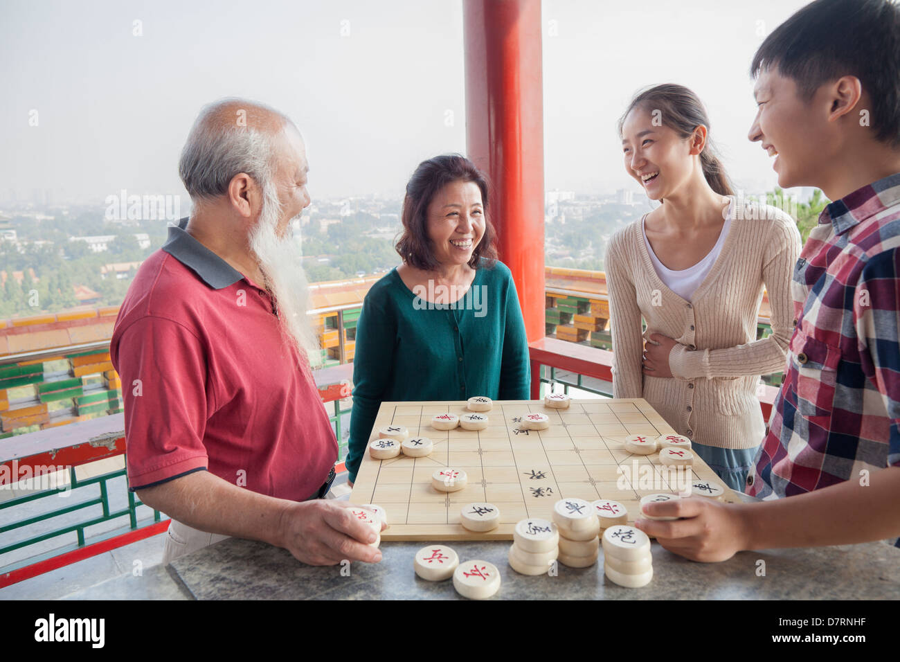 Chinese Family Playing Chinese Chess (Xiang Qi Stock Photo - Alamy
