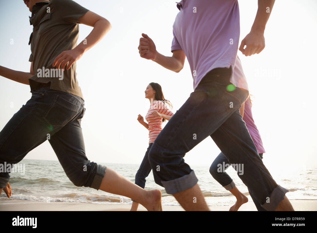 Friends Running at the Beach Stock Photo - Alamy